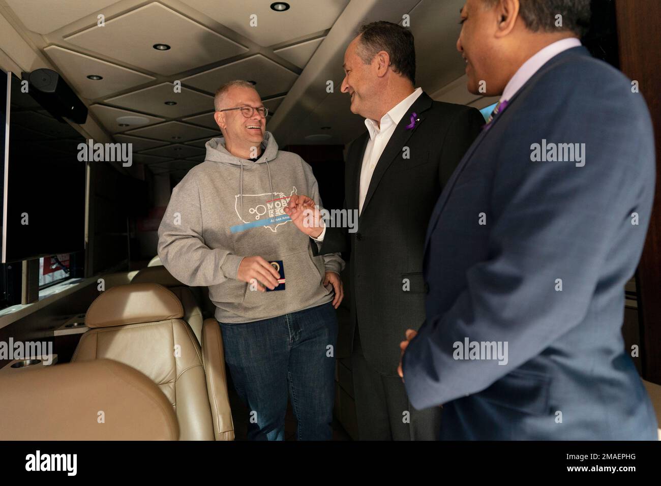 Douglas Emhoff, husband of Vice President Kamala Harris, center, and Dr ...