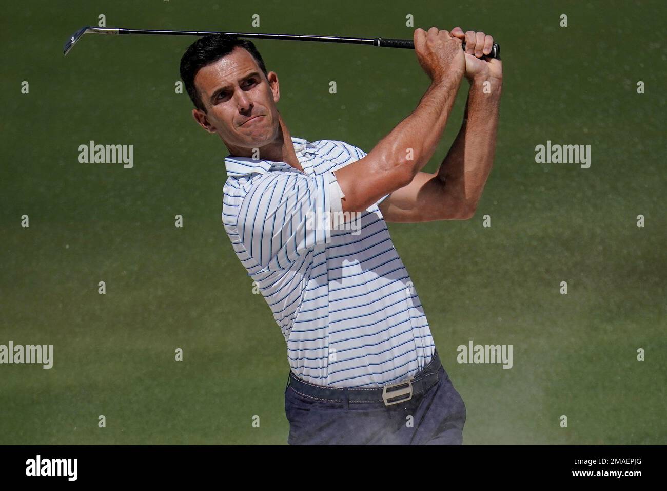 Billy Horschel hits from the bunker on the fifth hole during their fourball match at the ...