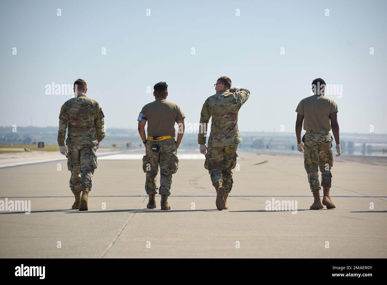 U.S. Airmen examine the flight line for foreign object debris (FOD ...
