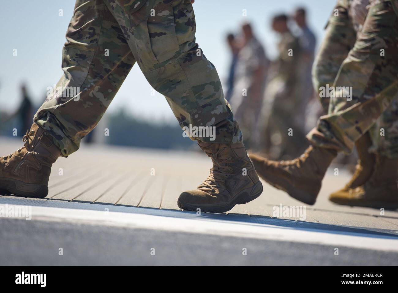 U.S. Airmen and NATO allies sweep the flight line during the first ...