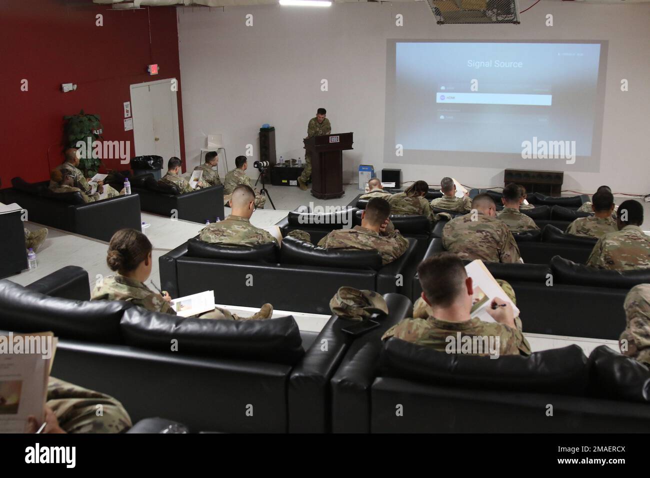Captain Titus Firmin teaches a class of new Unit Public Affairs ...