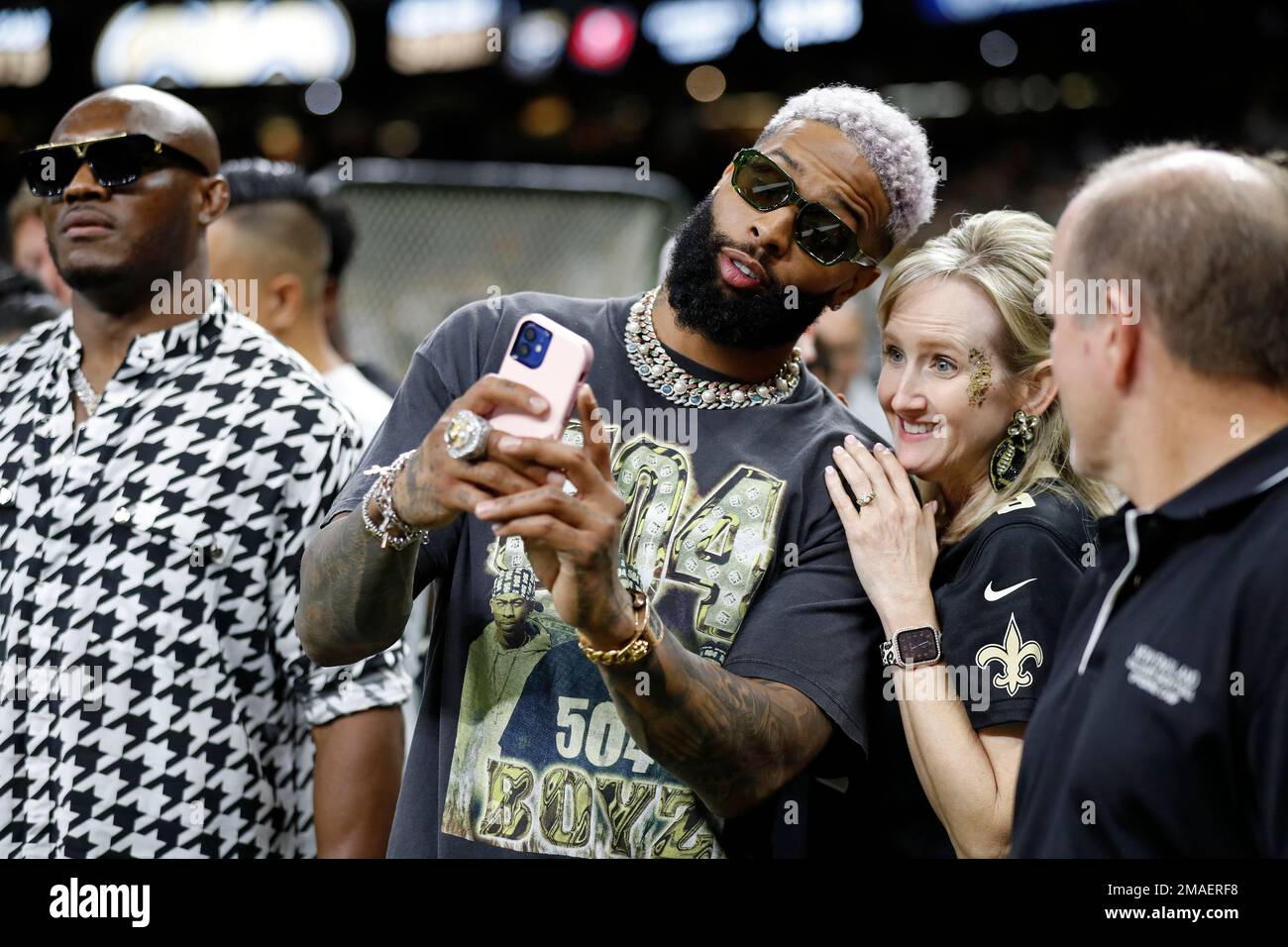 Odell Beckham Jr. takes a selfie with a fan before an NFL football game ...