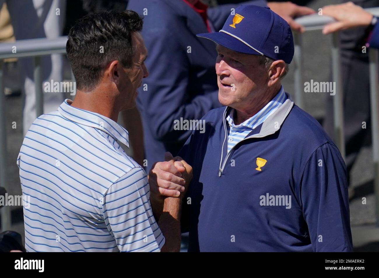 Former President George W. Bush speaks with Billy Horschel during a fourball match at the ...