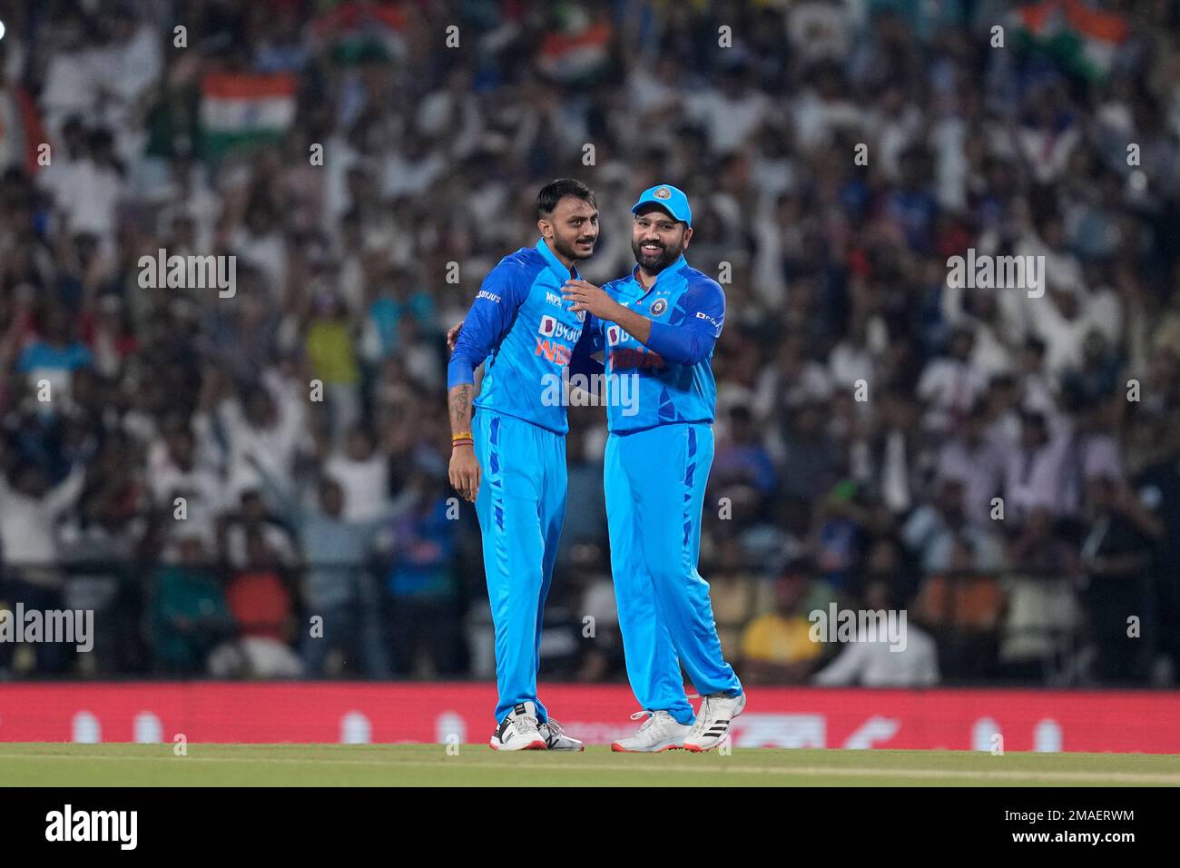 India's Axar Patel, left, celebrates with captain Rohit Sharma after ...