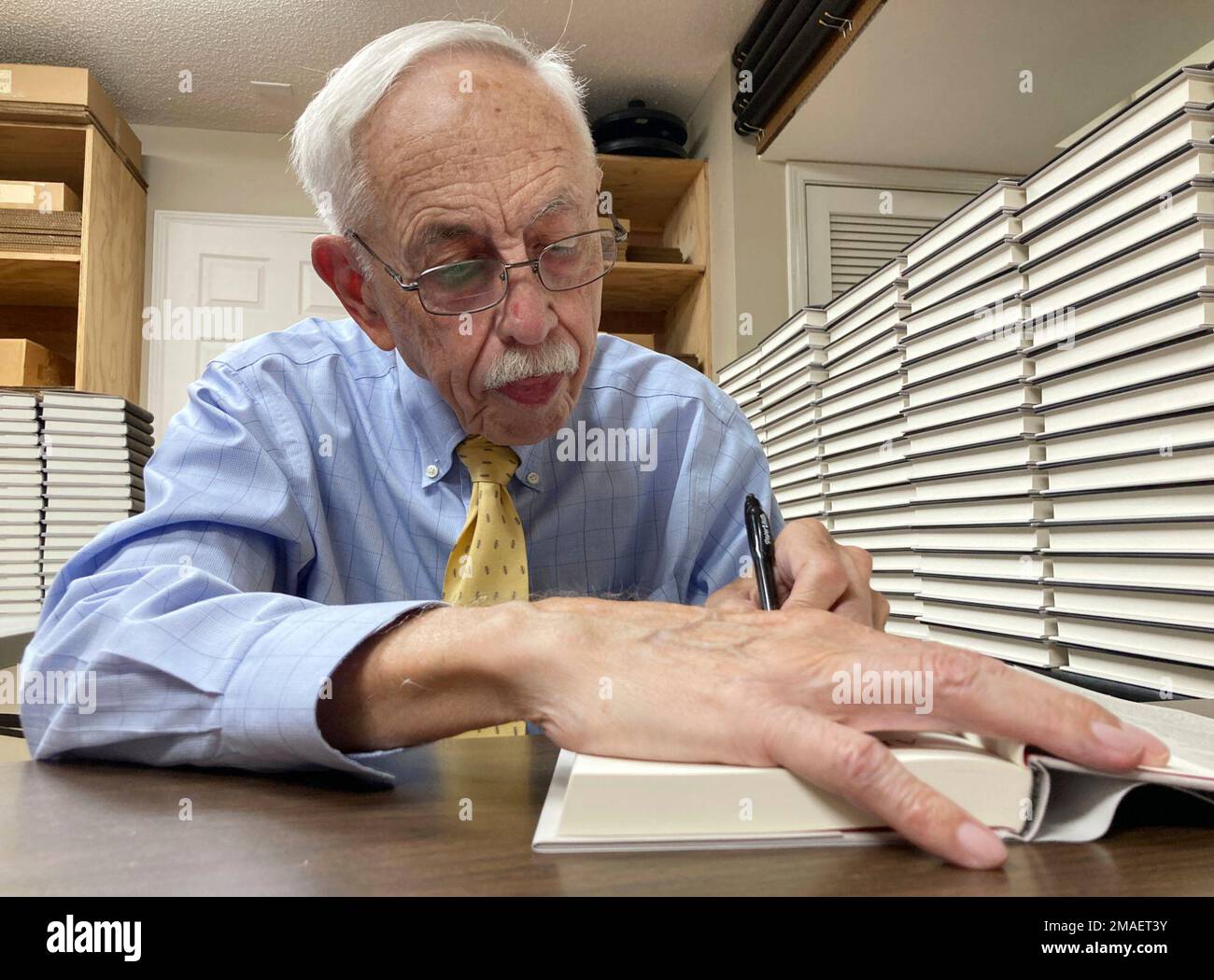Alabama historian Wayne Flynt signs a copy of his new book, "Afternoons ...