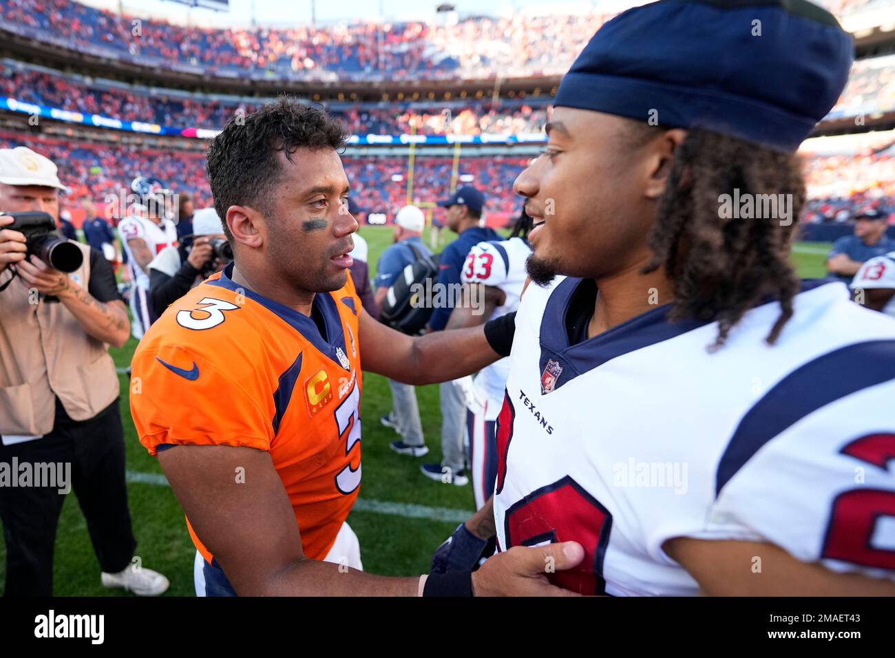 Denver Broncos quarterback Russell Wilson (3) and Houston Texans ...
