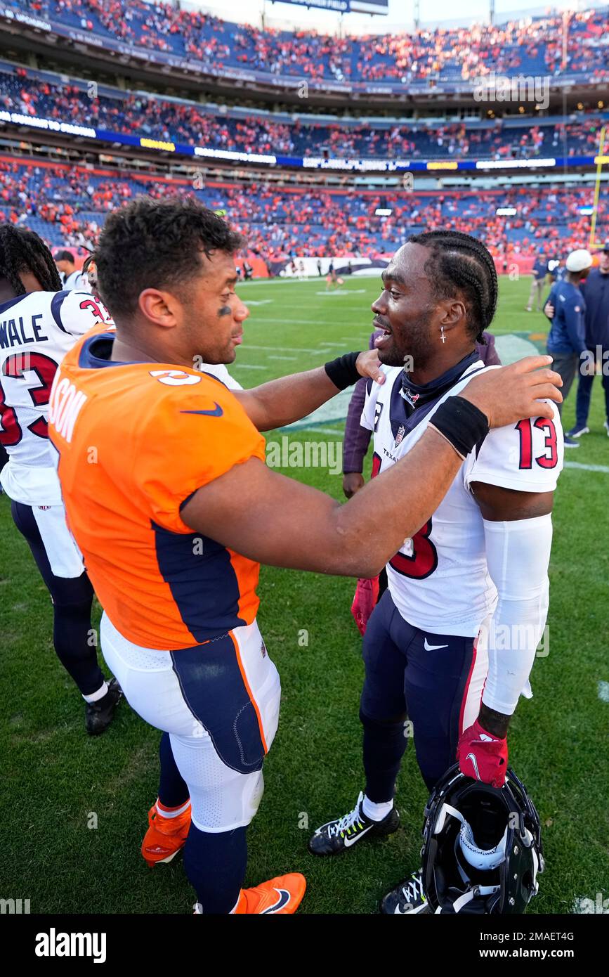 Denver Broncos quarterback Russell Wilson (3) and Houston Texans wide ...