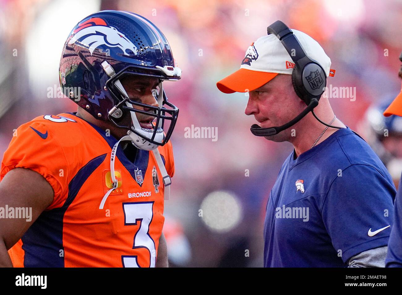 Denver Broncos quarterback Russell Wilson (3) talks with head coach ...