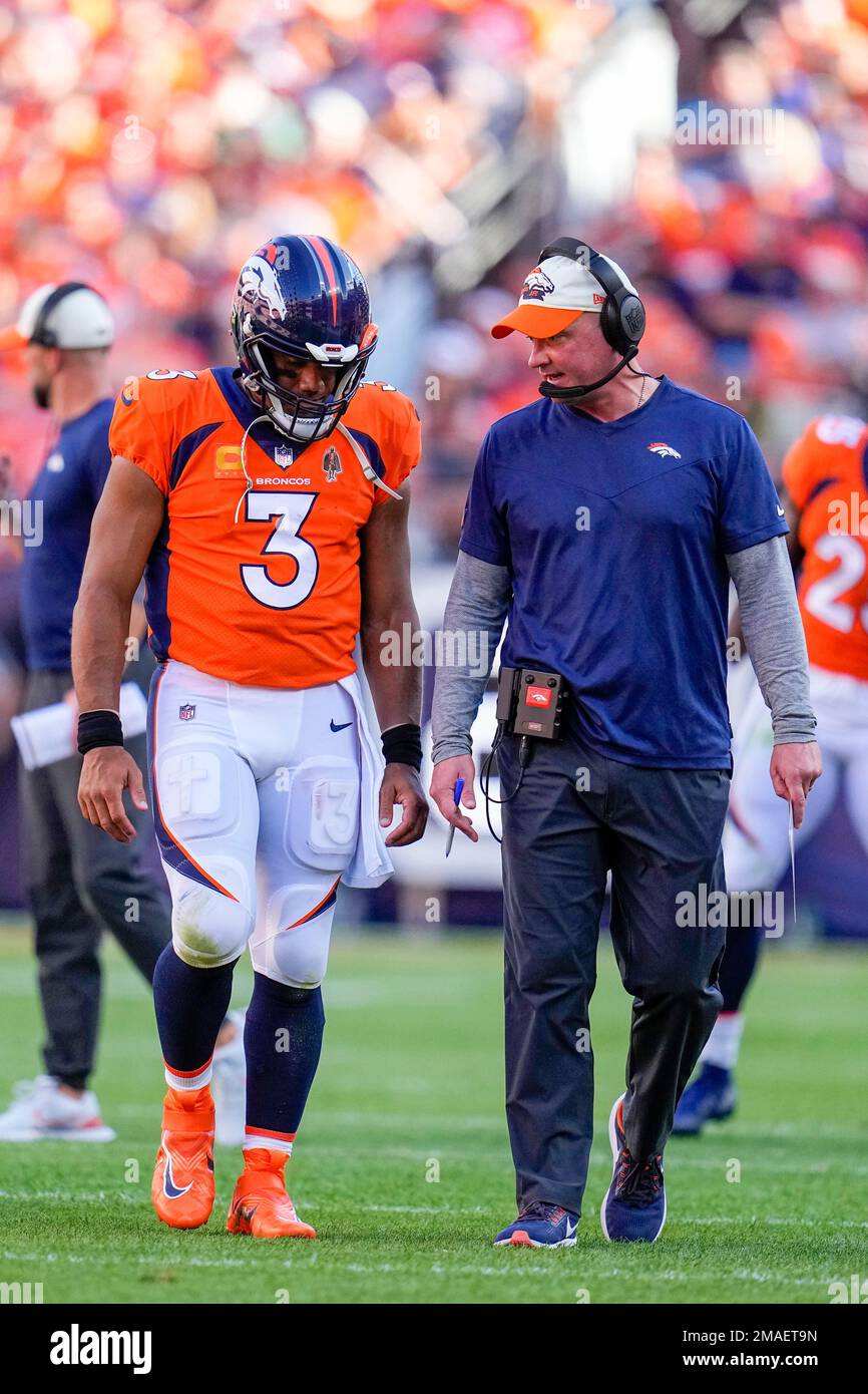 Denver Broncos quarterback Russell Wilson (3) talks with head coach ...