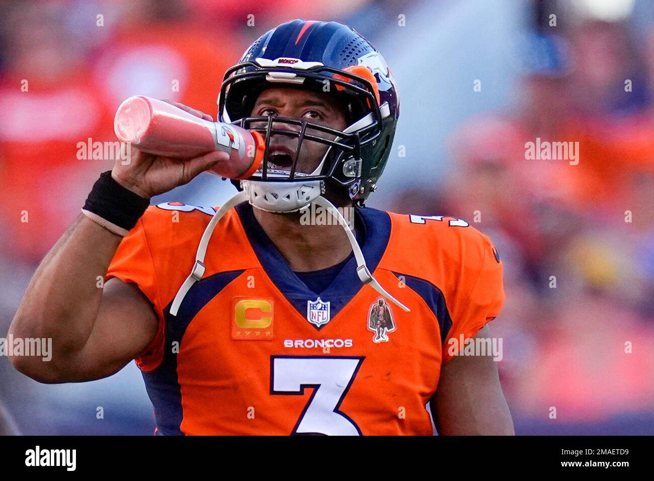 Denver Broncos quarterback Russell Wilson (3) take a drink against the ...