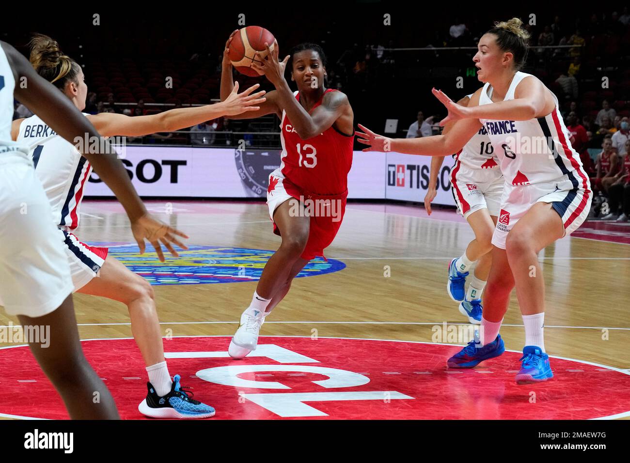 Canada's Shay Colley, centre, runs at France's Alexia Chartereau, right ...