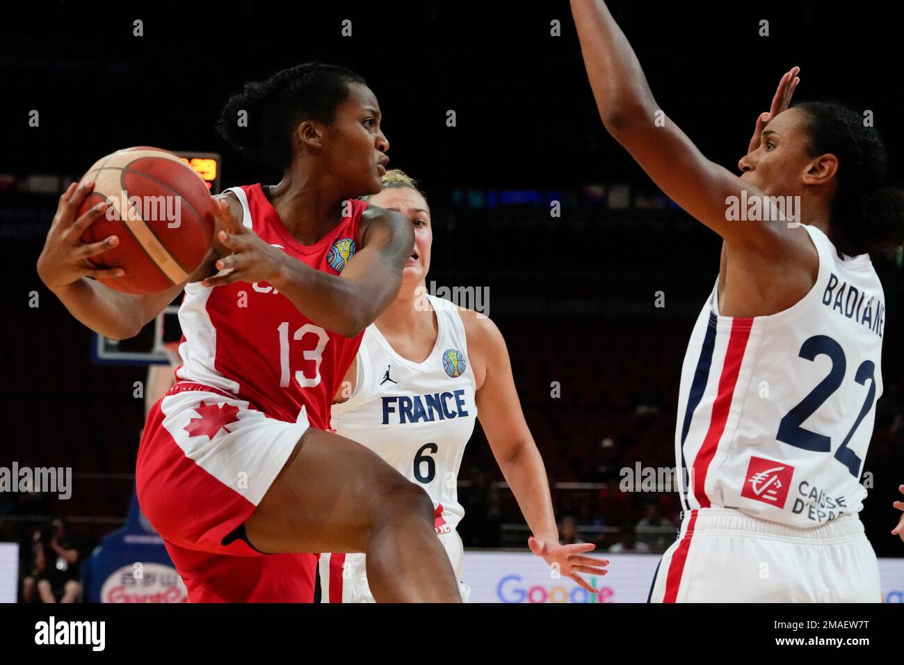 Canada's Shay Colley runs at France's Marieme Badiane, right, during ...