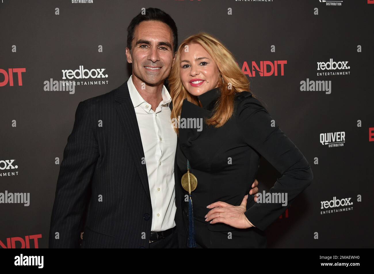 Nestor Carbonell, left, and Olivia D'Abo arrive at the world premiere ...