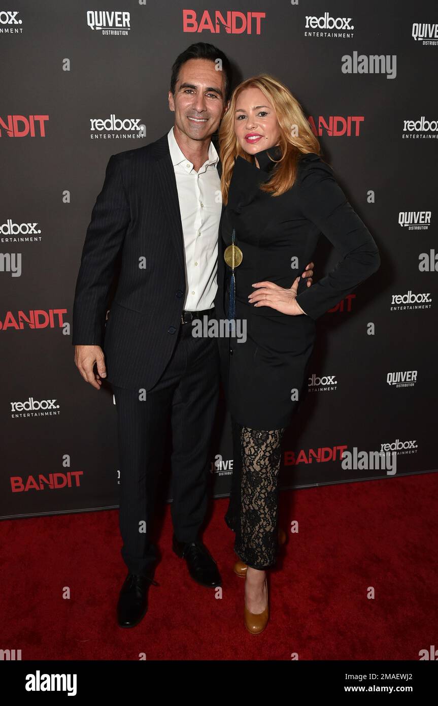 Nestor Carbonell, left, and Olivia D'Abo arrive at the world premiere ...