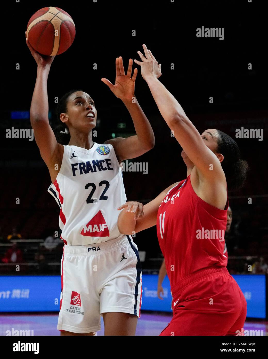 France's Marieme Badiane shoots for goal as Canada's Natalie Achonwa ...
