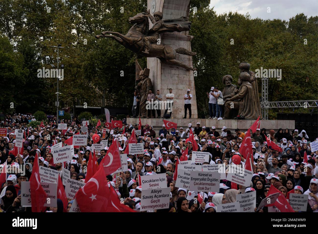 FILE - Demonstrators holding Turkish flags attend an anti LGBTQ protest ...