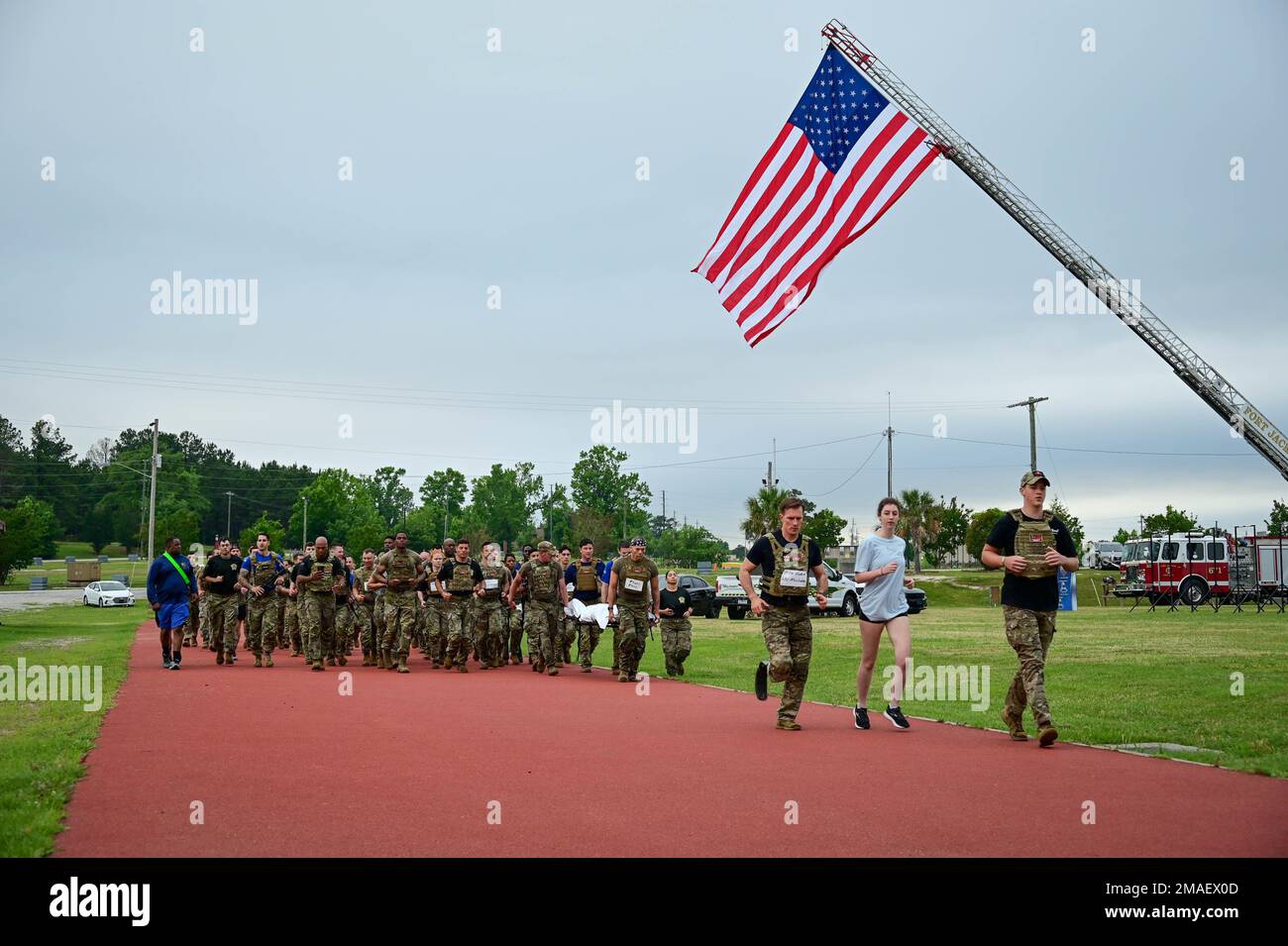 Members of the 165th Infantry Brigade run a victory lap around Patton ...