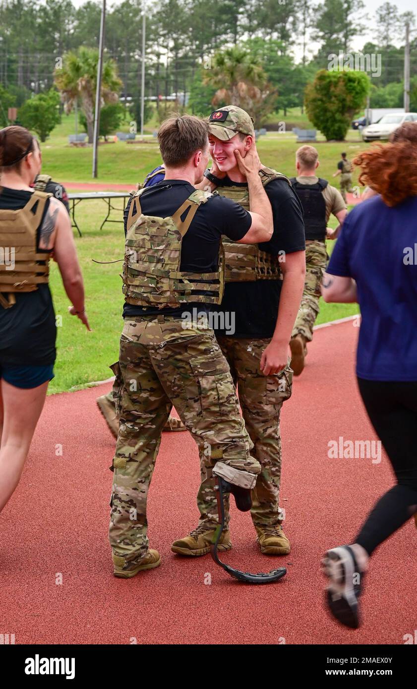 Col. Kent G. Solheim, 165th Infantry Brigade commander, left, embraces ...