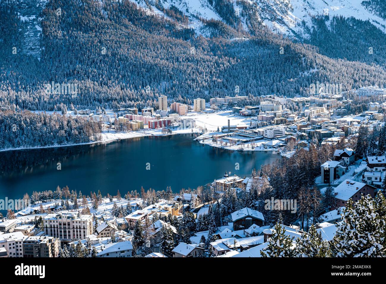 Top view of the lake and town of St. Moritz covered in snow during ...