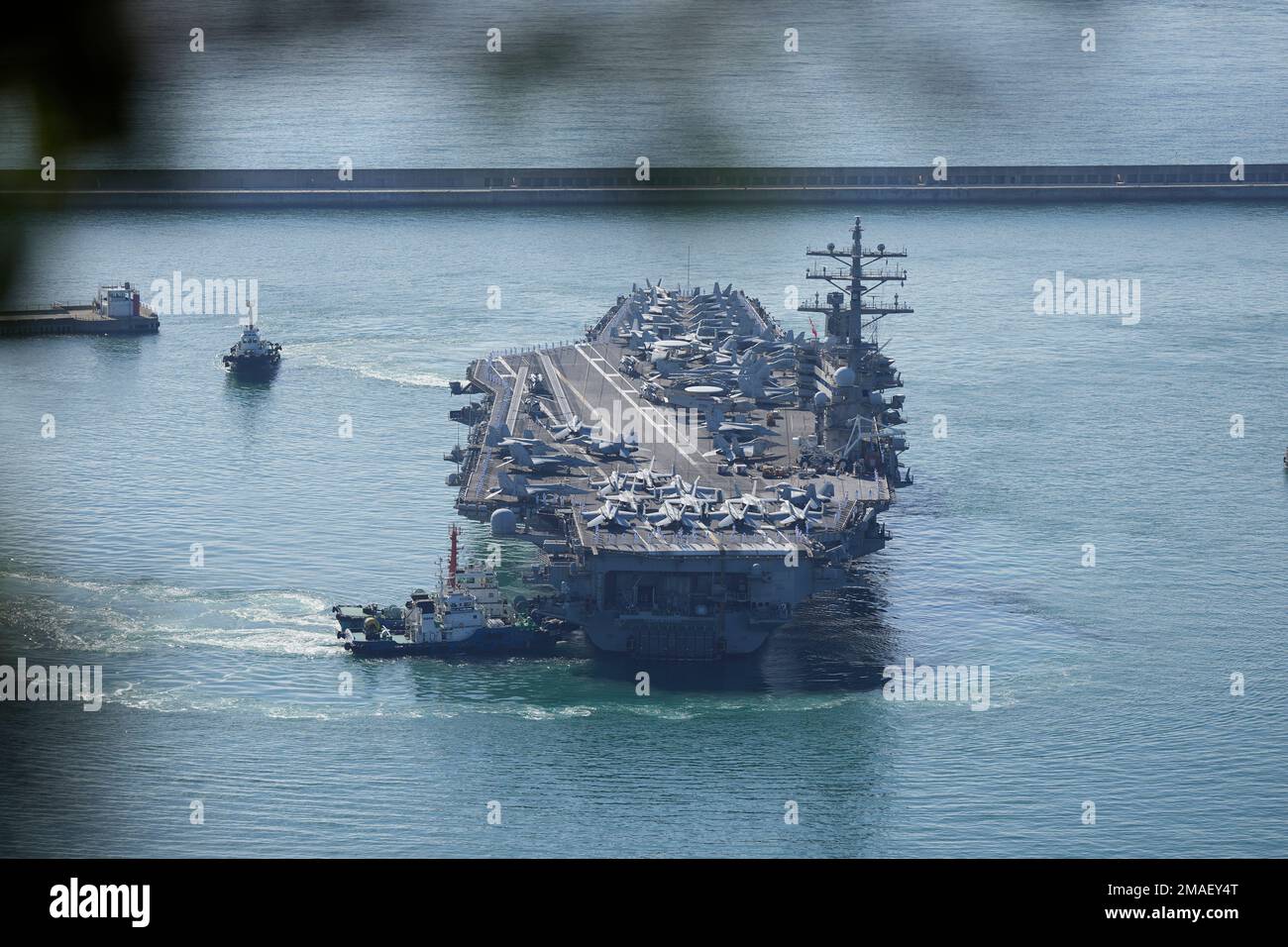 U.S. aircraft carrier USS Ronald Reagan is escorted into Busan Naval ...