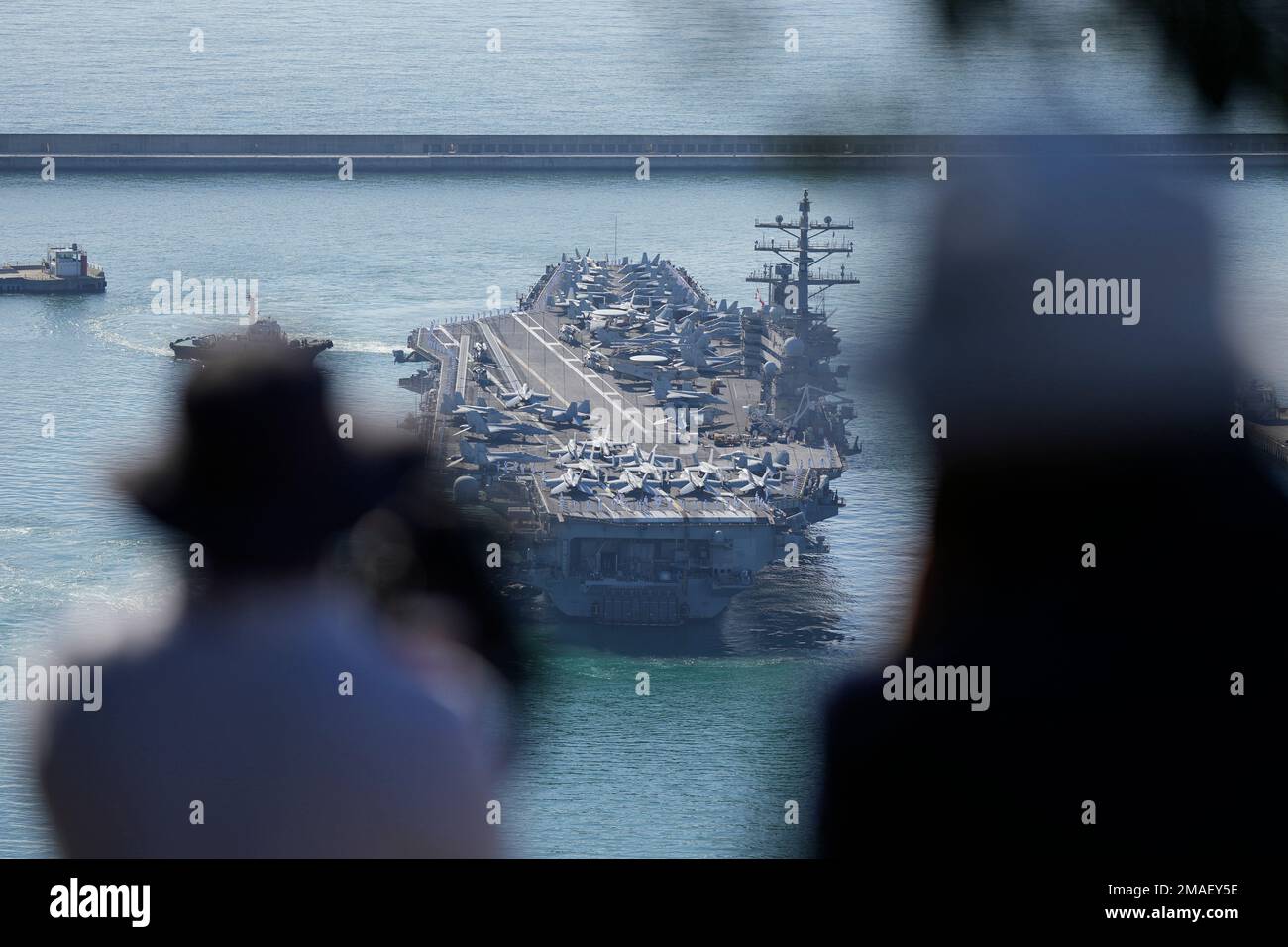 U.S. aircraft carrier USS Ronald Reagan is escorted into Busan Naval ...
