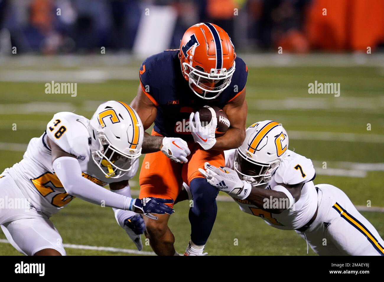 Illinois running back Chase Brown is tackled by Chattanooga defensive ...