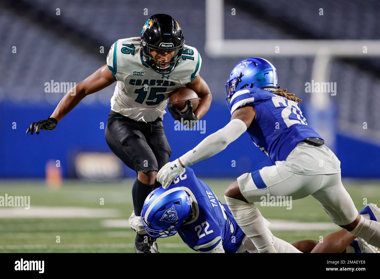 Coastal Carolina wide receiver Sam Pinckney (15) is tackled by Georgia ...