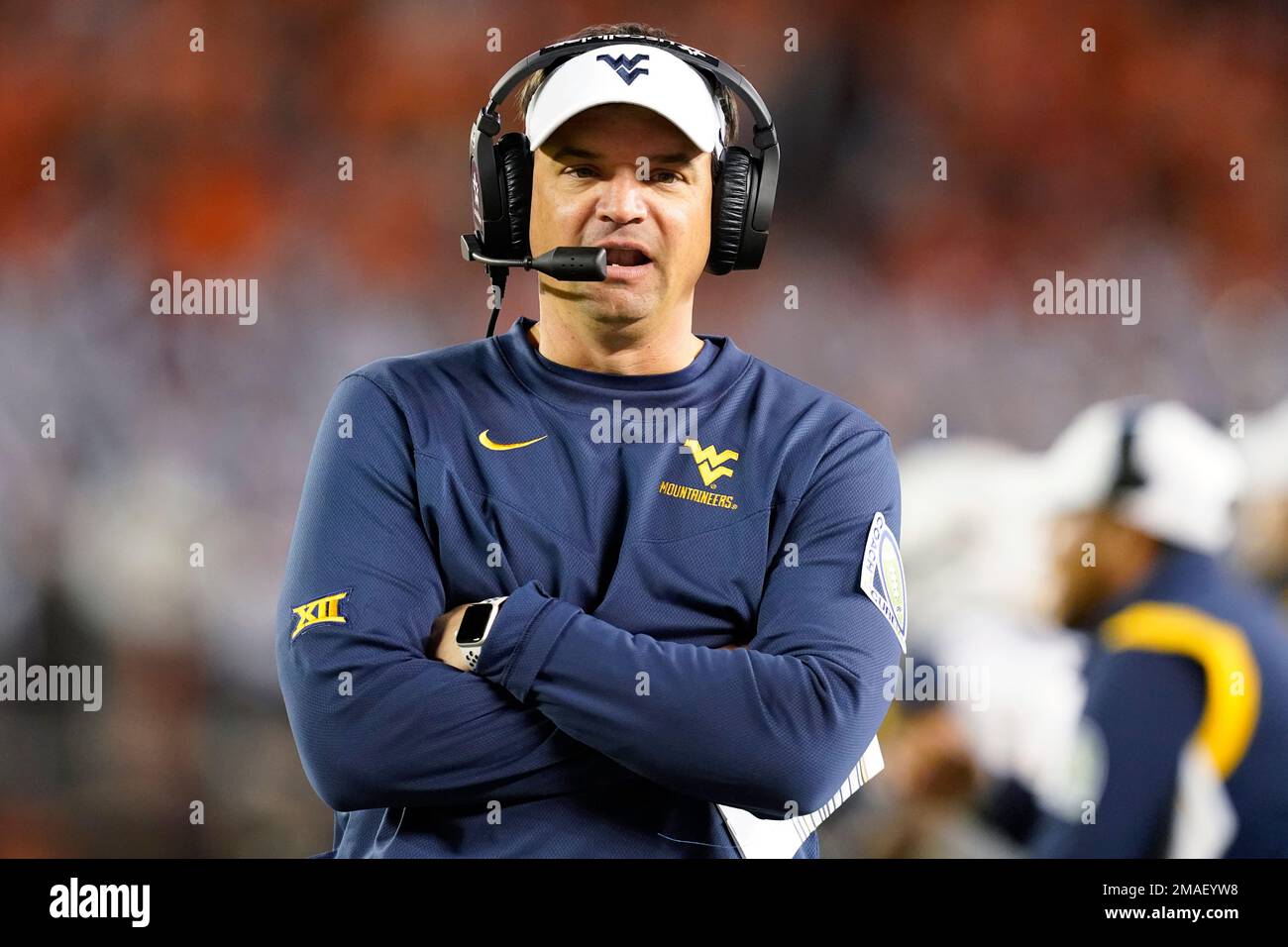 West Virginia coach Neal Brown stands along the sideline during the ...