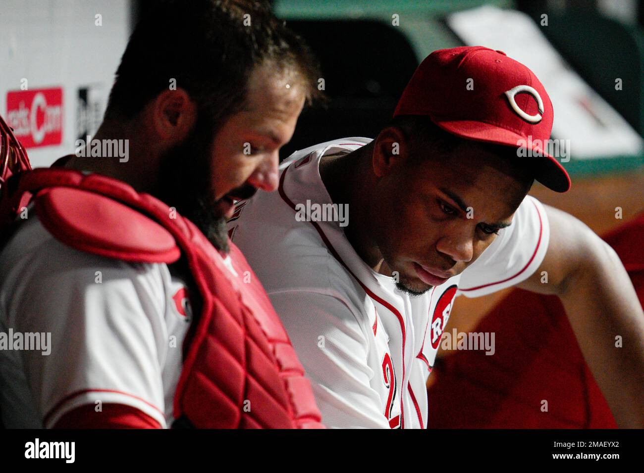 Cincinnati Reds starting pitcher Hunter Greene, right, sits in the ...