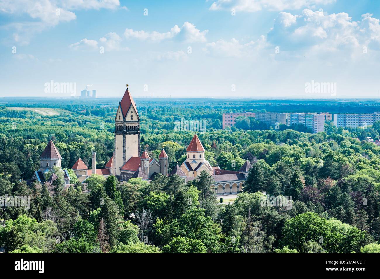 A drone view of the South Cemetery surrounded by many green trees and ...