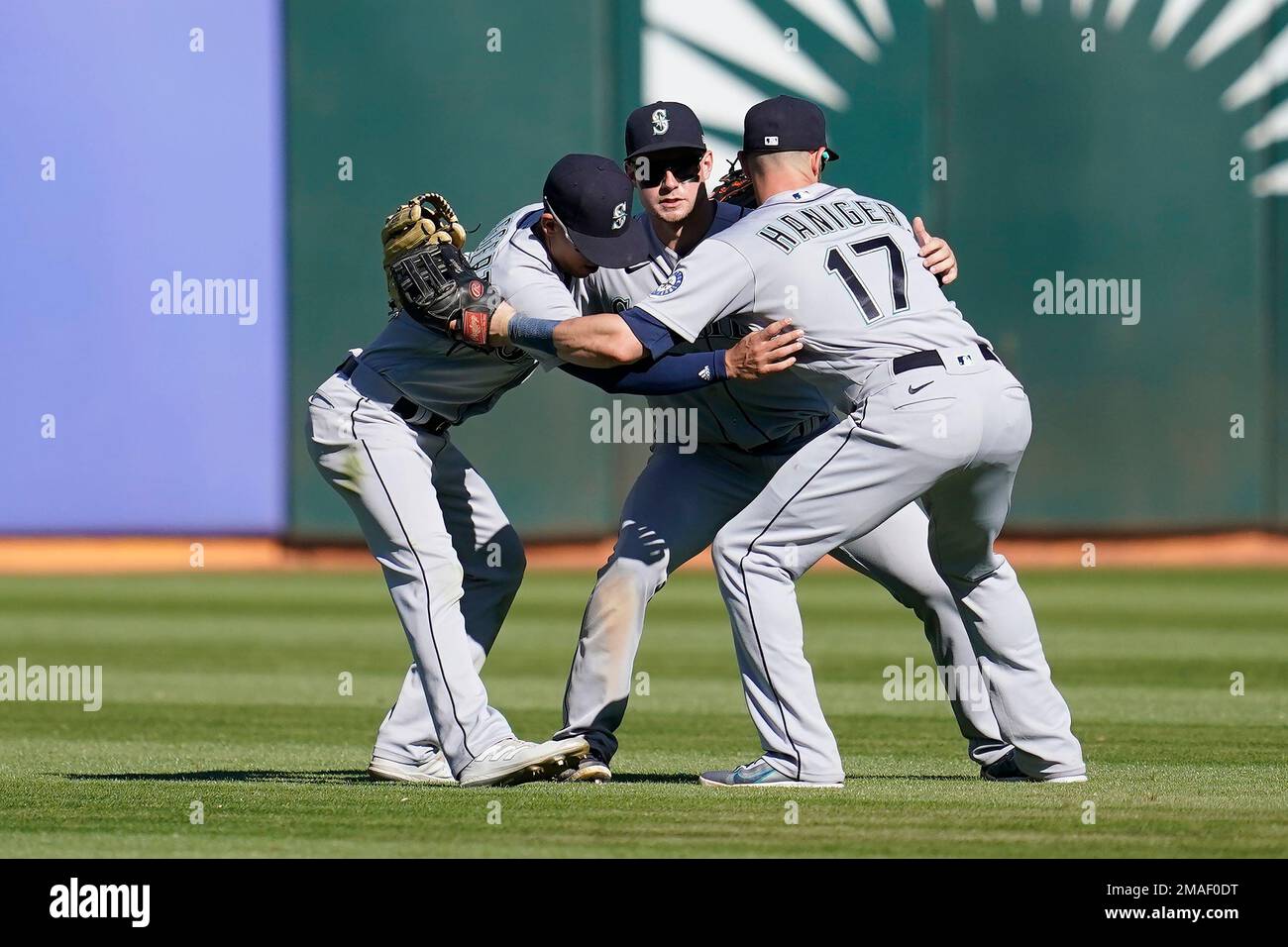 Seattle Mariners' Sam Haggerty, from left, celebrates with Jarred ...