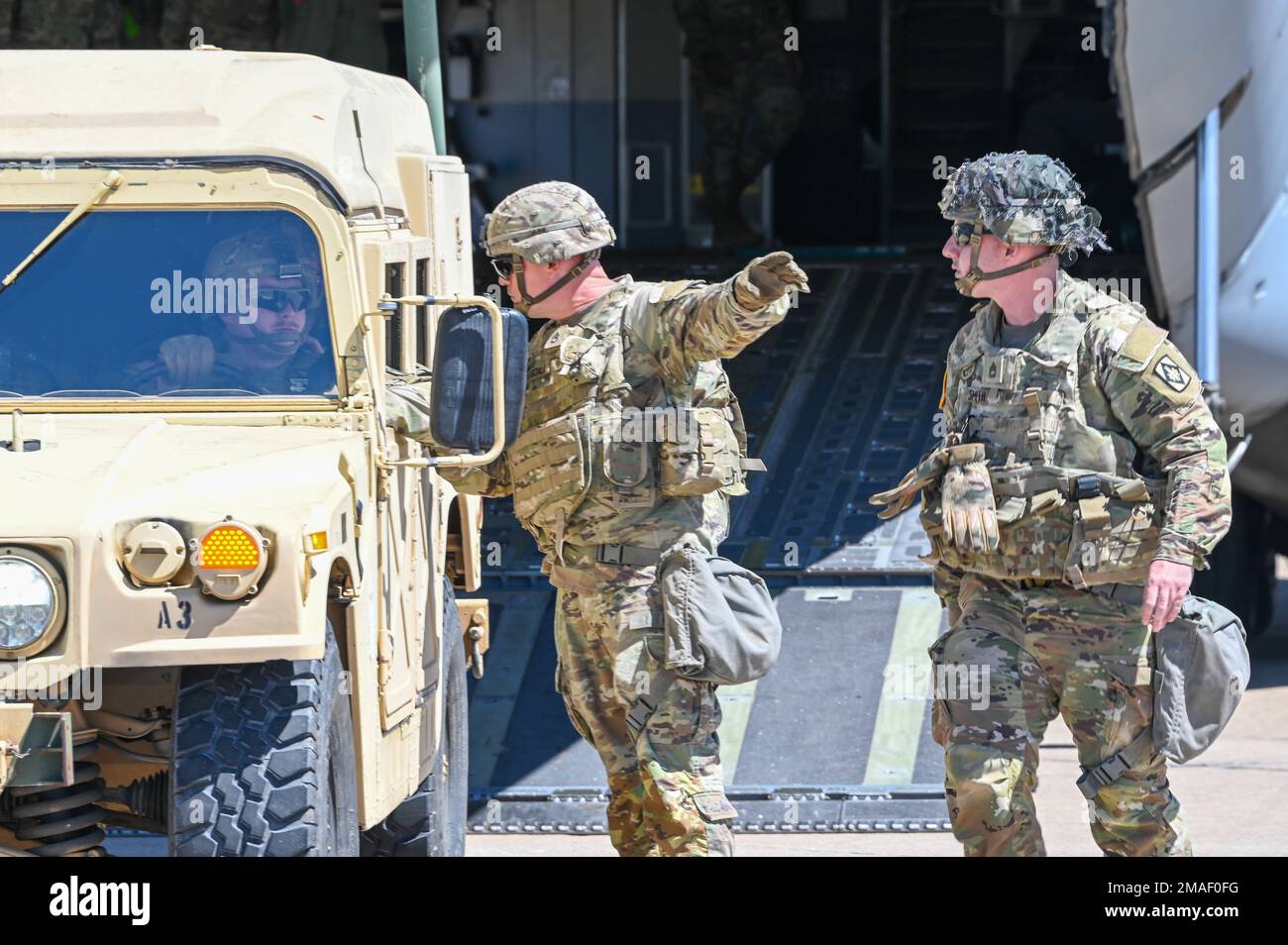 Soldiers talk outside a C-17 Globemaster III at Fort Sill, Oklahoma ...
