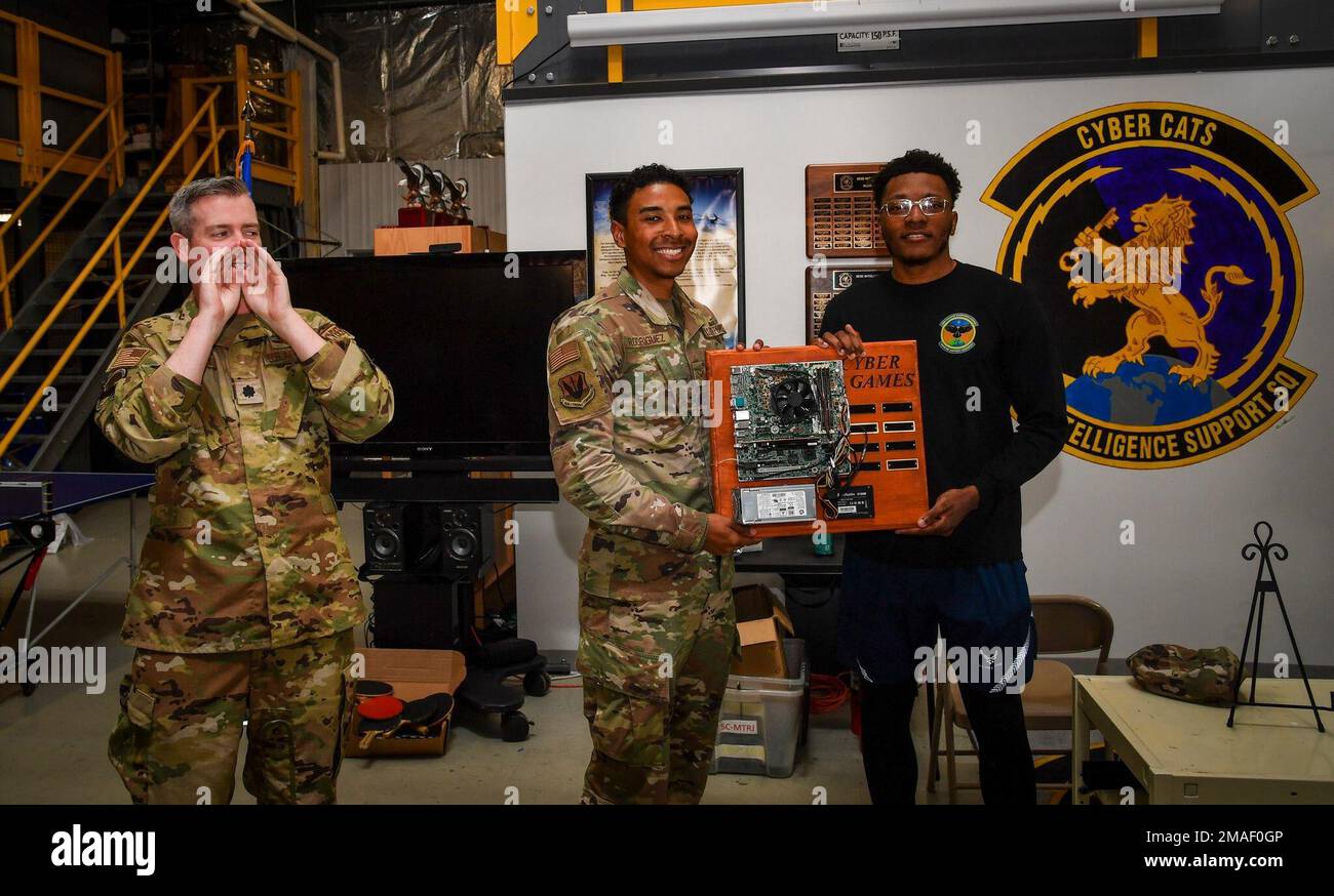 Cyber Airmen from the 700th Air Support Squadron, pose with a trophy ...