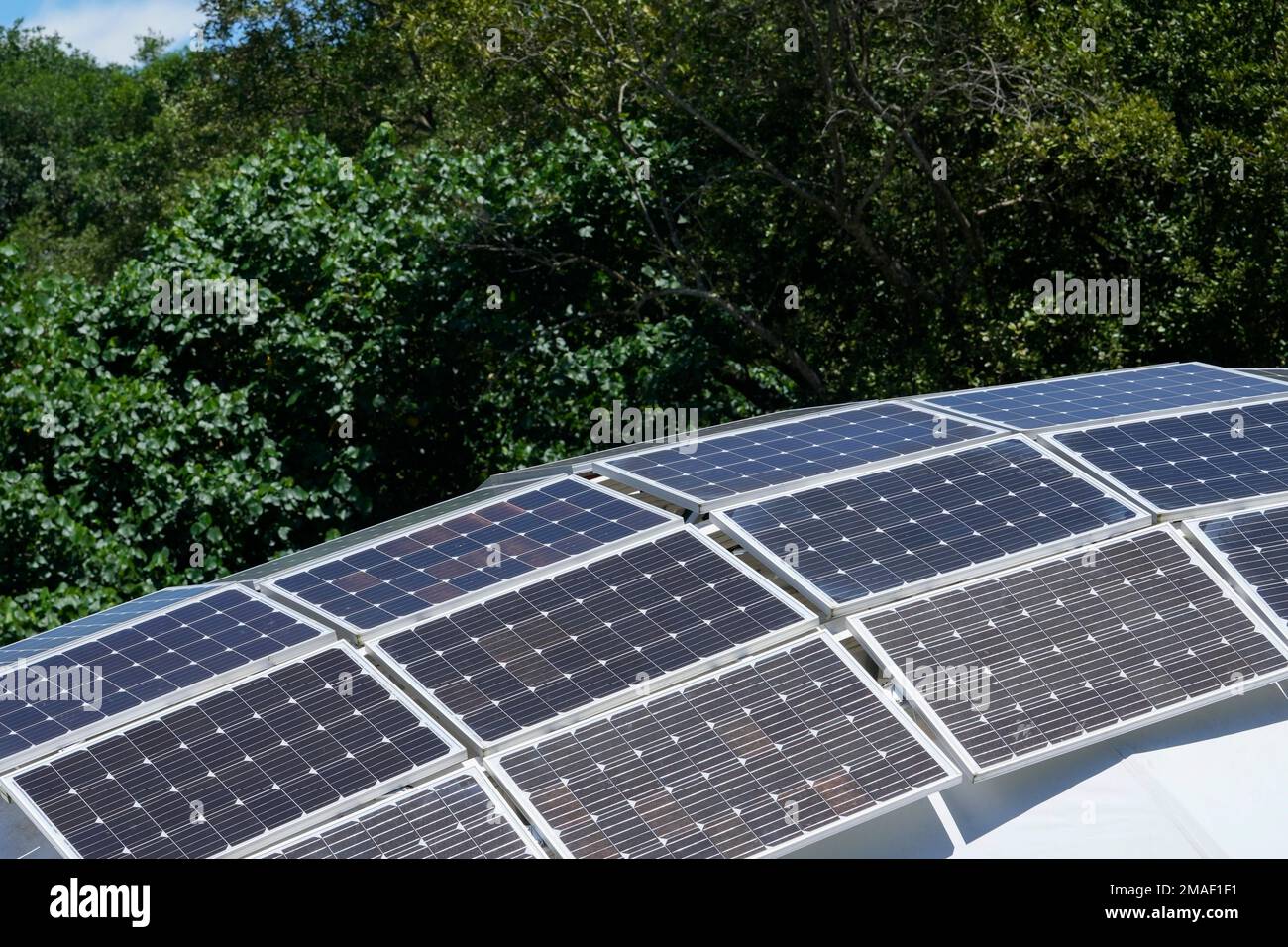 Solar panels sit atop the Wanda Diaz solar-powered hydraulic wheel that ...