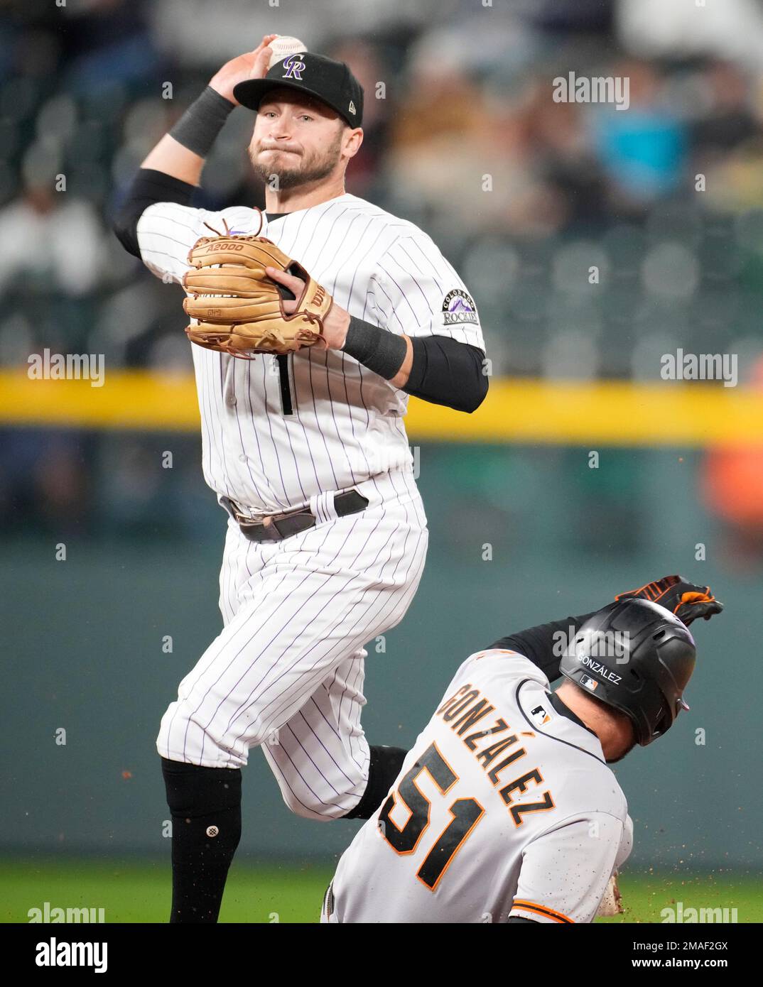 Colorado Rockies shortstop Garrett Hampson (1) throws over San ...