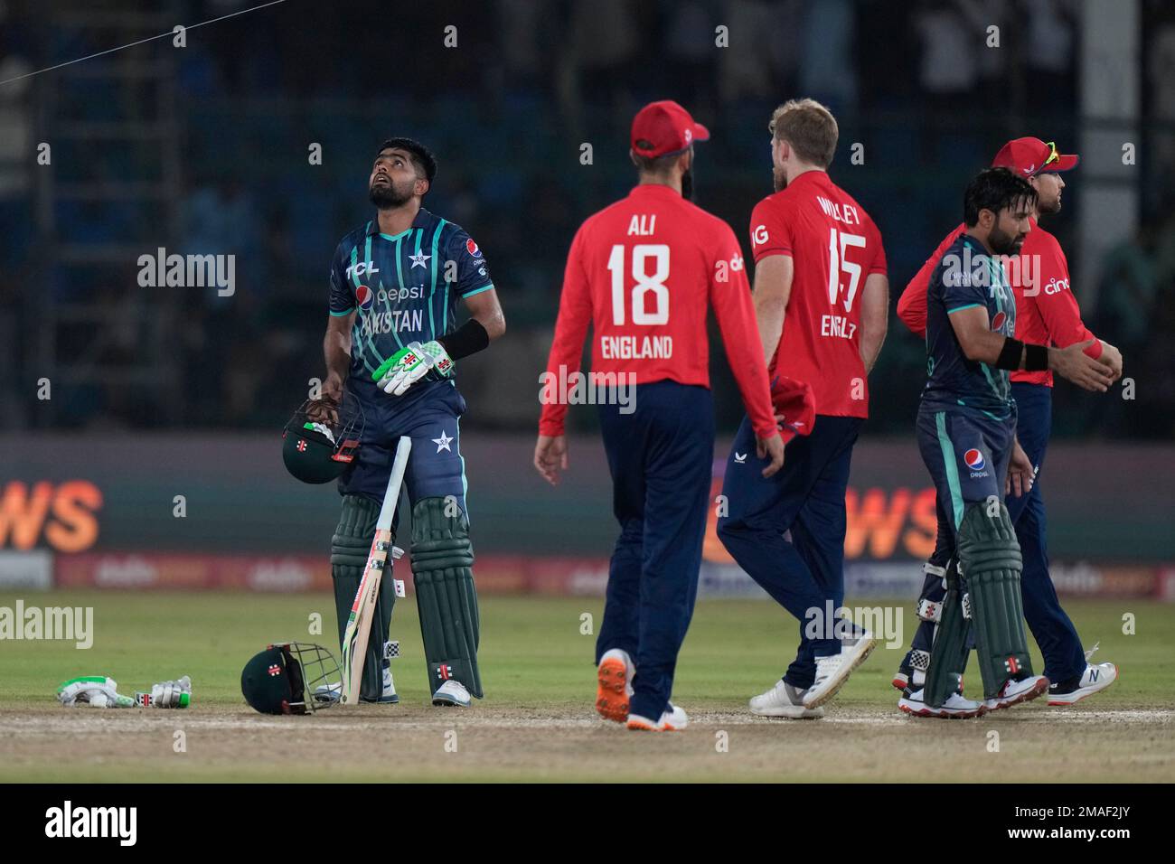 Pakistan's captain Babar Azam, left, reacts after their win in the ...