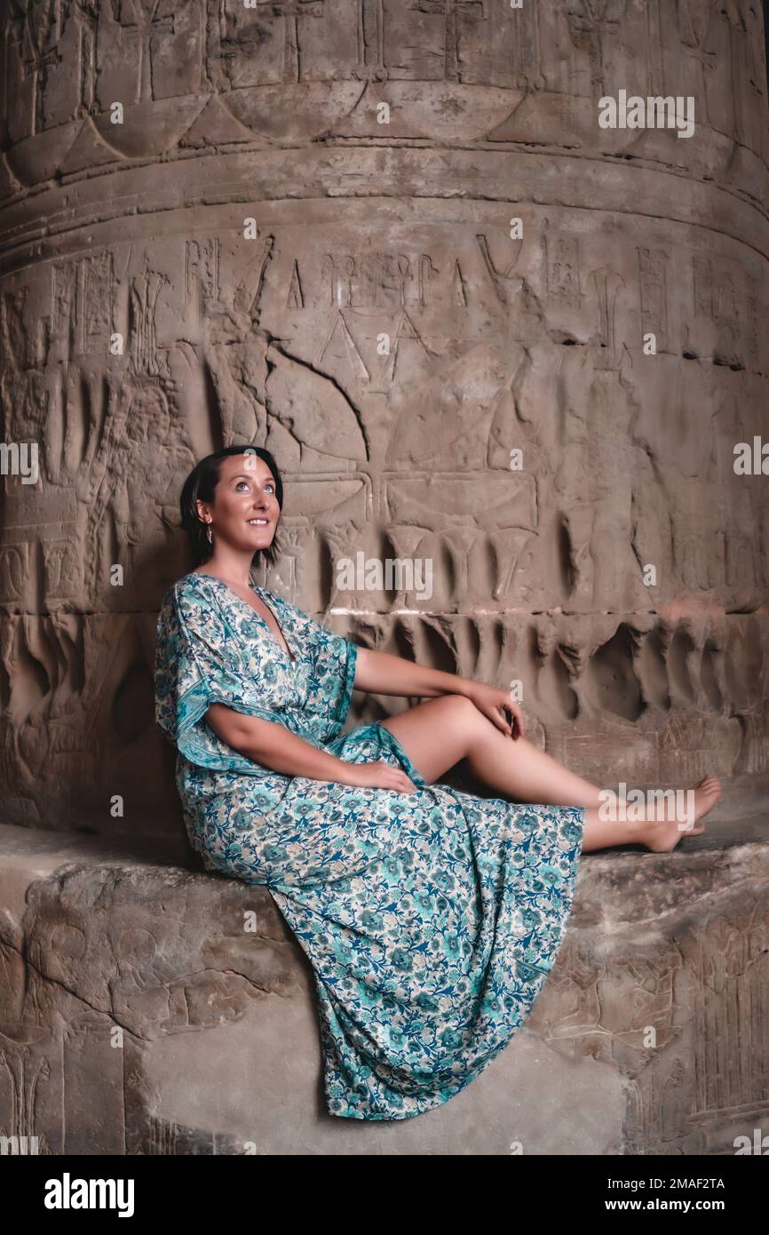 A vertical of a woman resting in an ancient pyramid in Egypt Stock ...