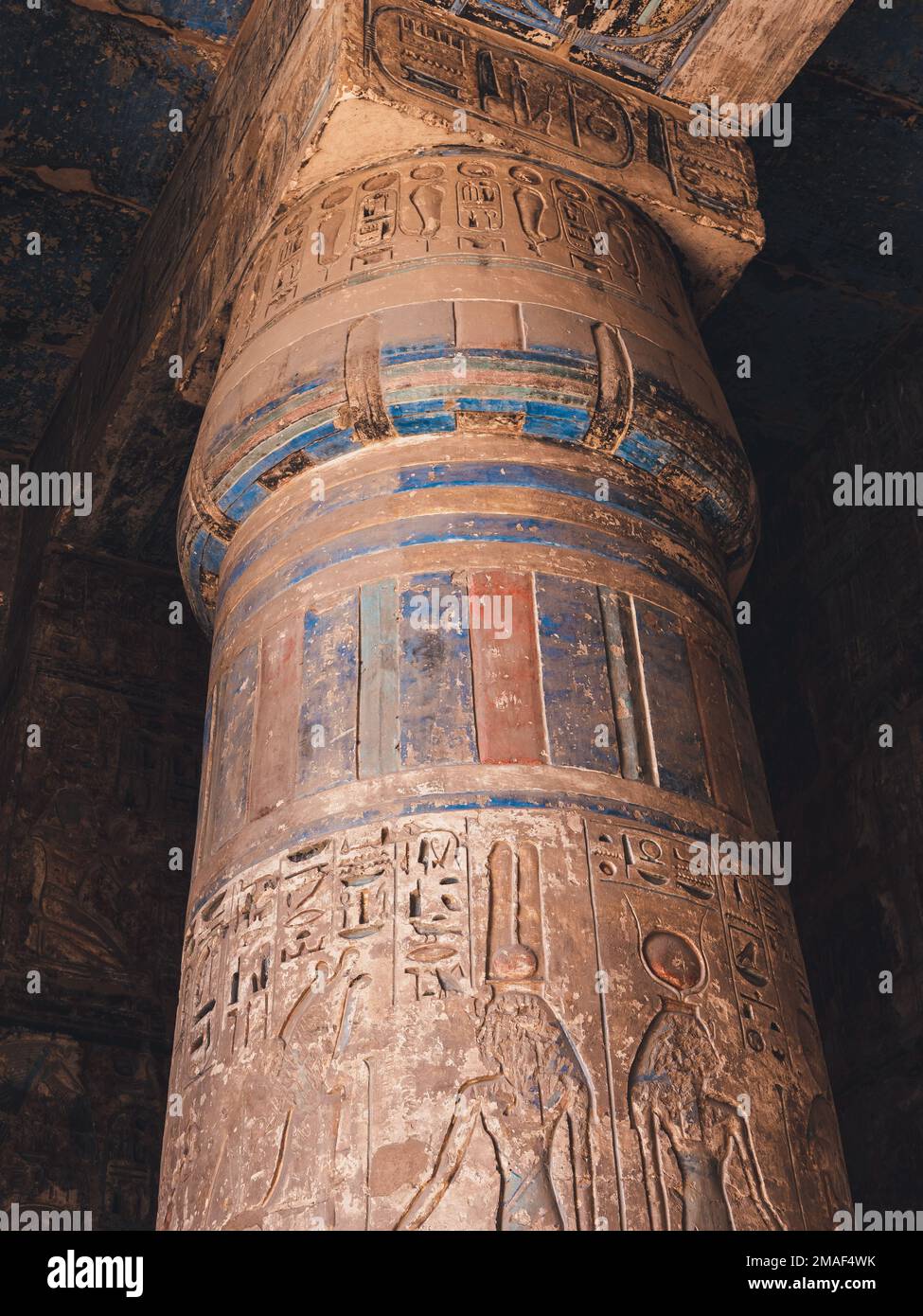 Colourful column with hieroglyphs in Habu Temple, Luxor, Egypt Stock ...