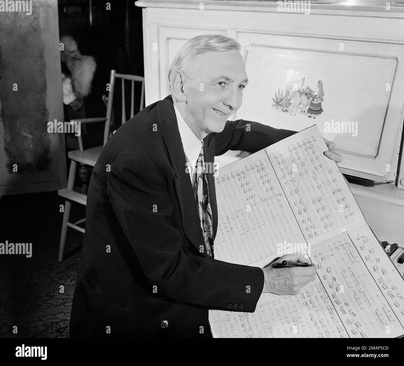 Charles Wakefield Cadman, composer of popular musical numbers, is shown ...