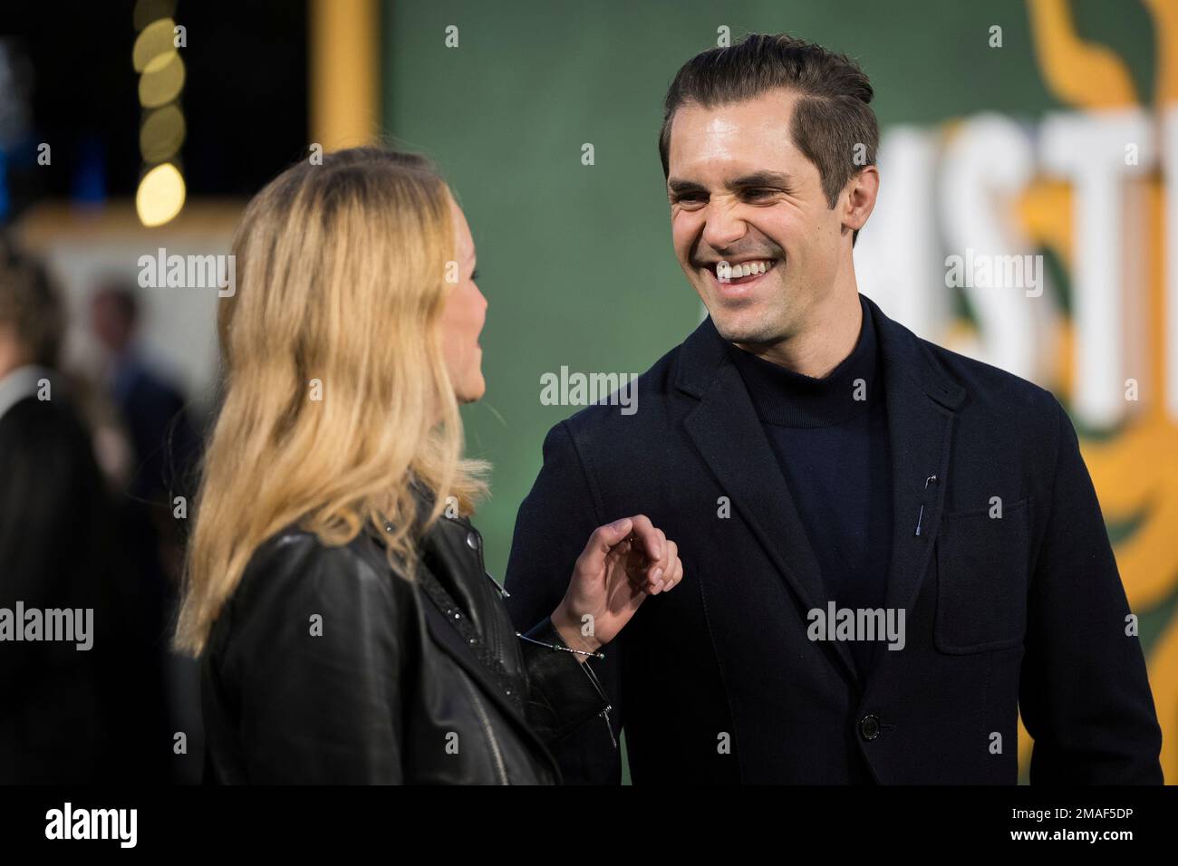 Eleanor Heydon, left, and Phil Dunster pose for photographers upon ...