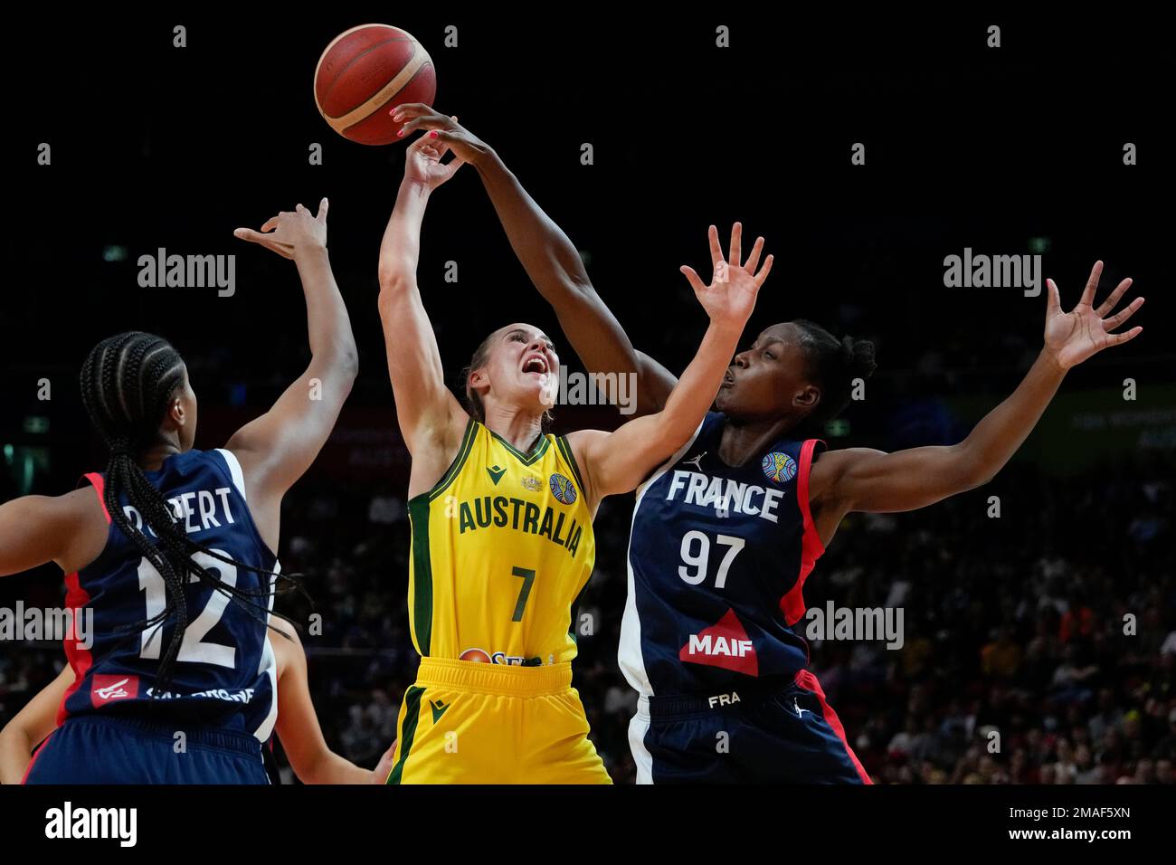France's Kendra Chery, right, and Iliana Rupert block a shot by ...