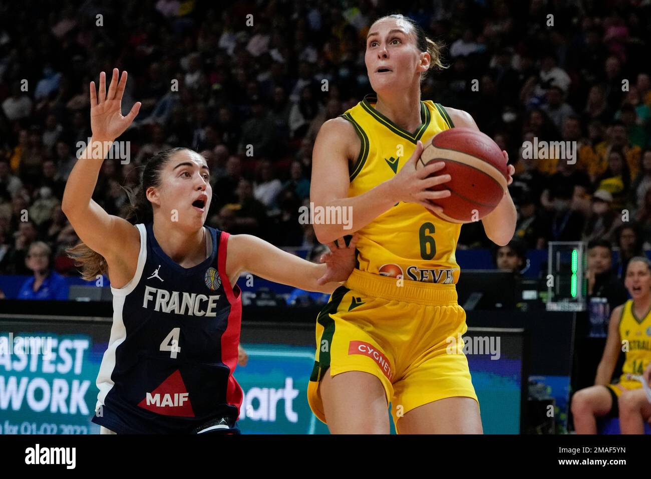 Australia's Steph Talbot, left, looks to take a shot as France's Marine ...