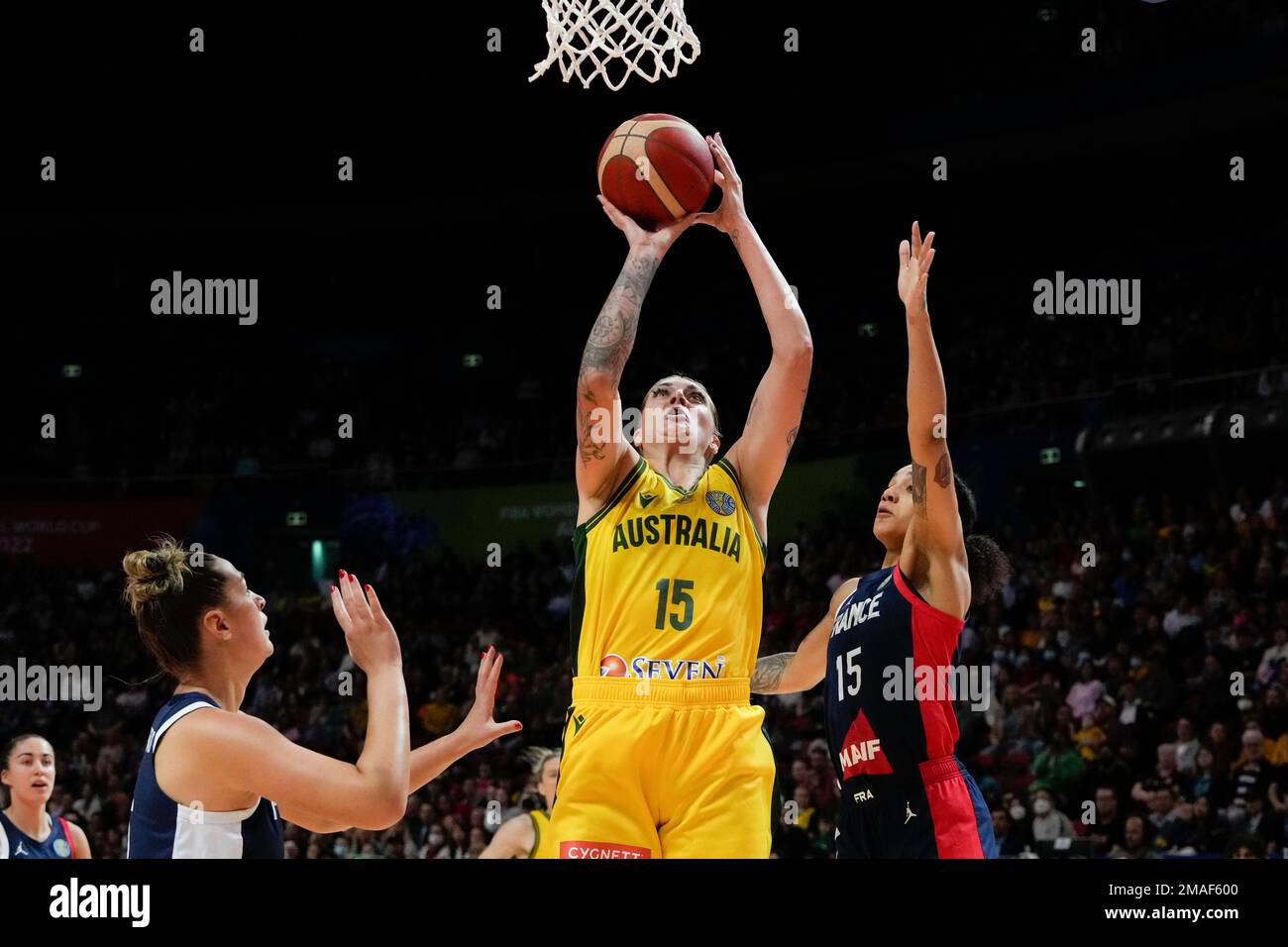 Australia's Cayla George takes a shot at goal as France's Gabby ...