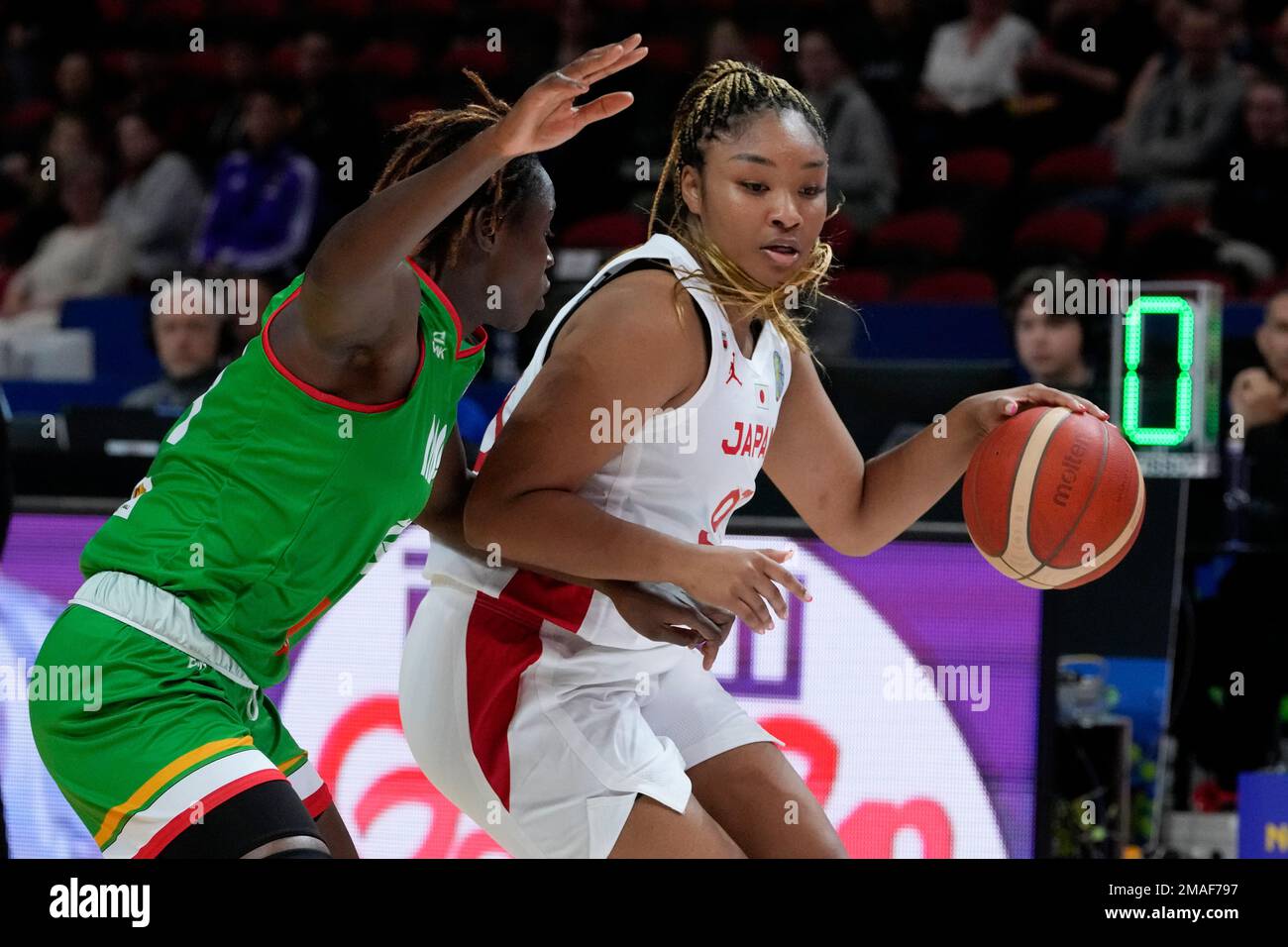 Japan's Monica Okoye, right, attempts to pass Mali's Kankou Coulibaly ...