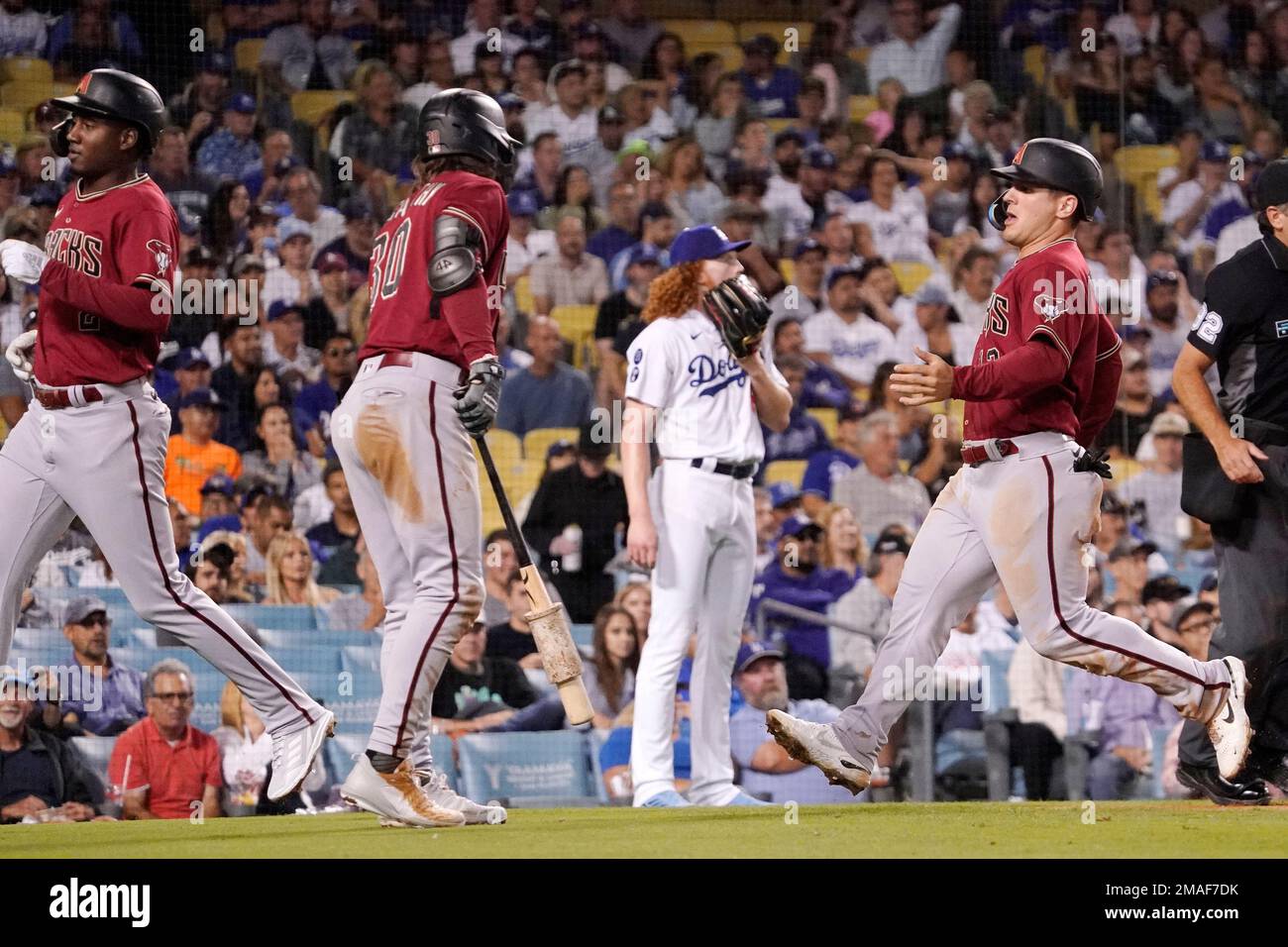 Arizona Diamondbacks' Daulton Varsho, right, and Geraldo Perdomo, left ...