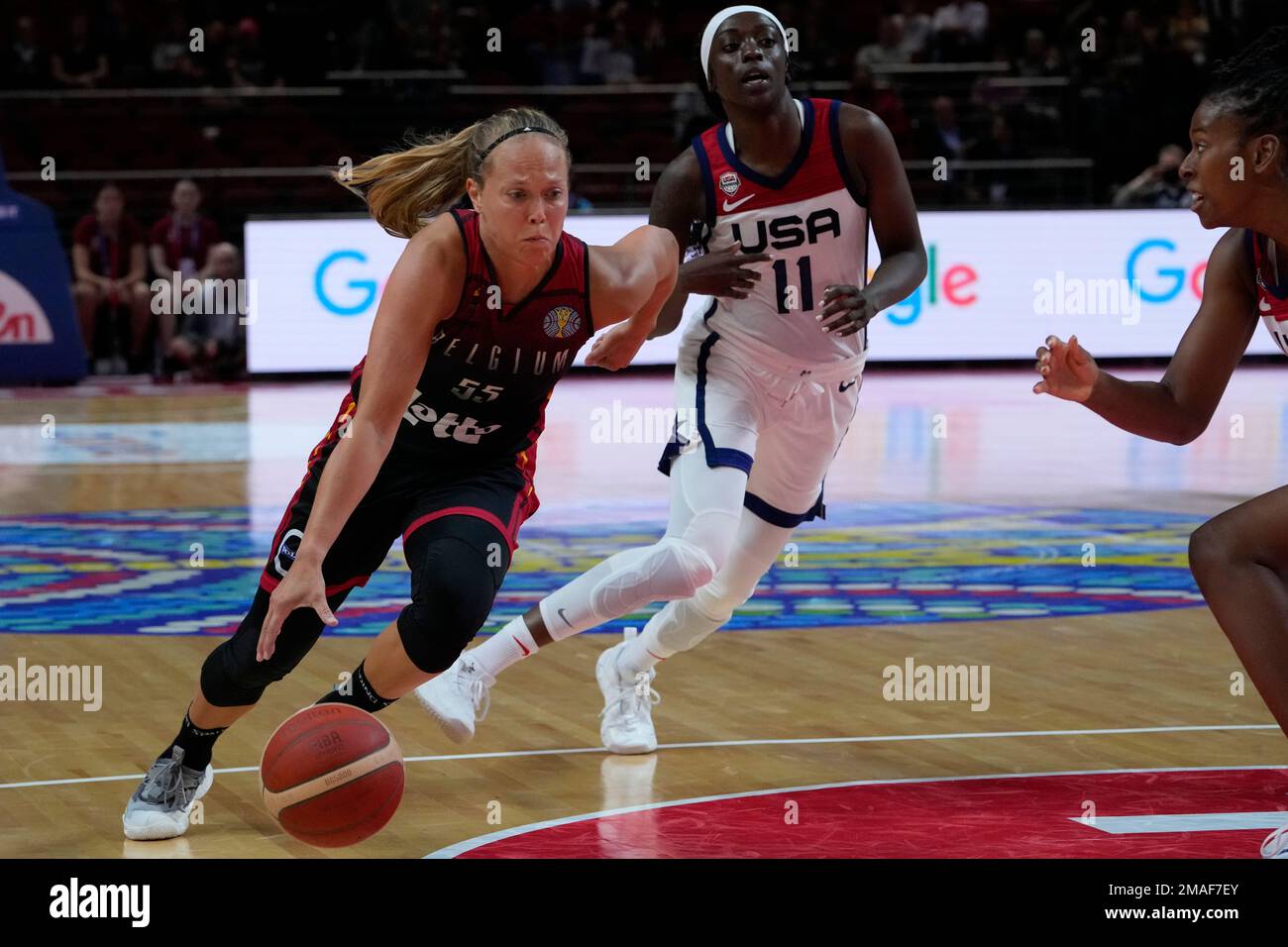 Belgium's Julie Allemand, left, gets past the United States' Ariel ...