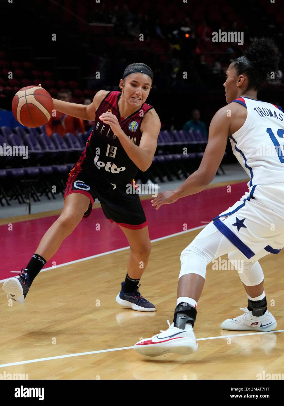 Belgium's Hind Ben Abdelkader, left, looks to go around United States ...