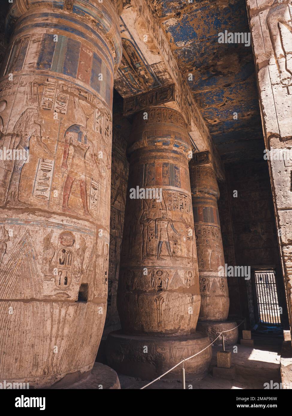 Colourful columns with hieroglyphs in Habu Temple, Luxor, Egypt Stock ...