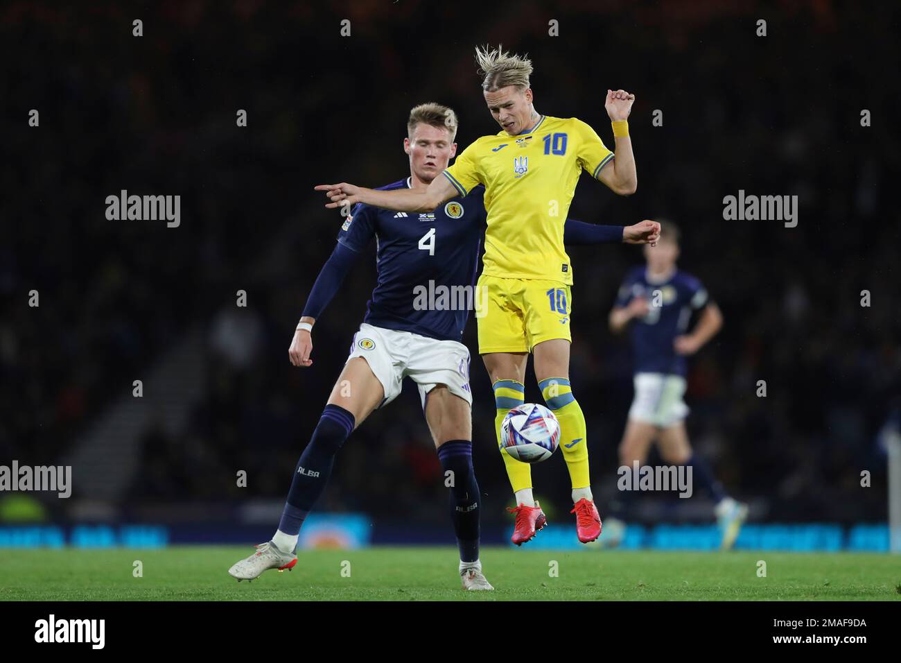 Ukrainian Mykhaylo Mudryk, right, is challenged by Scotland's Scott McTomminay during the UEFA ...