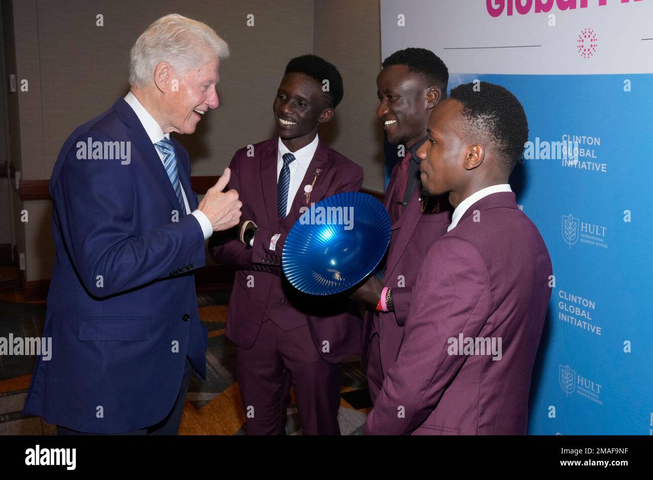 IMAGE DISTRIBUTED FOR HULT PRIZE - Former US President Bill Clinton talks to Brian Ndung'u ...